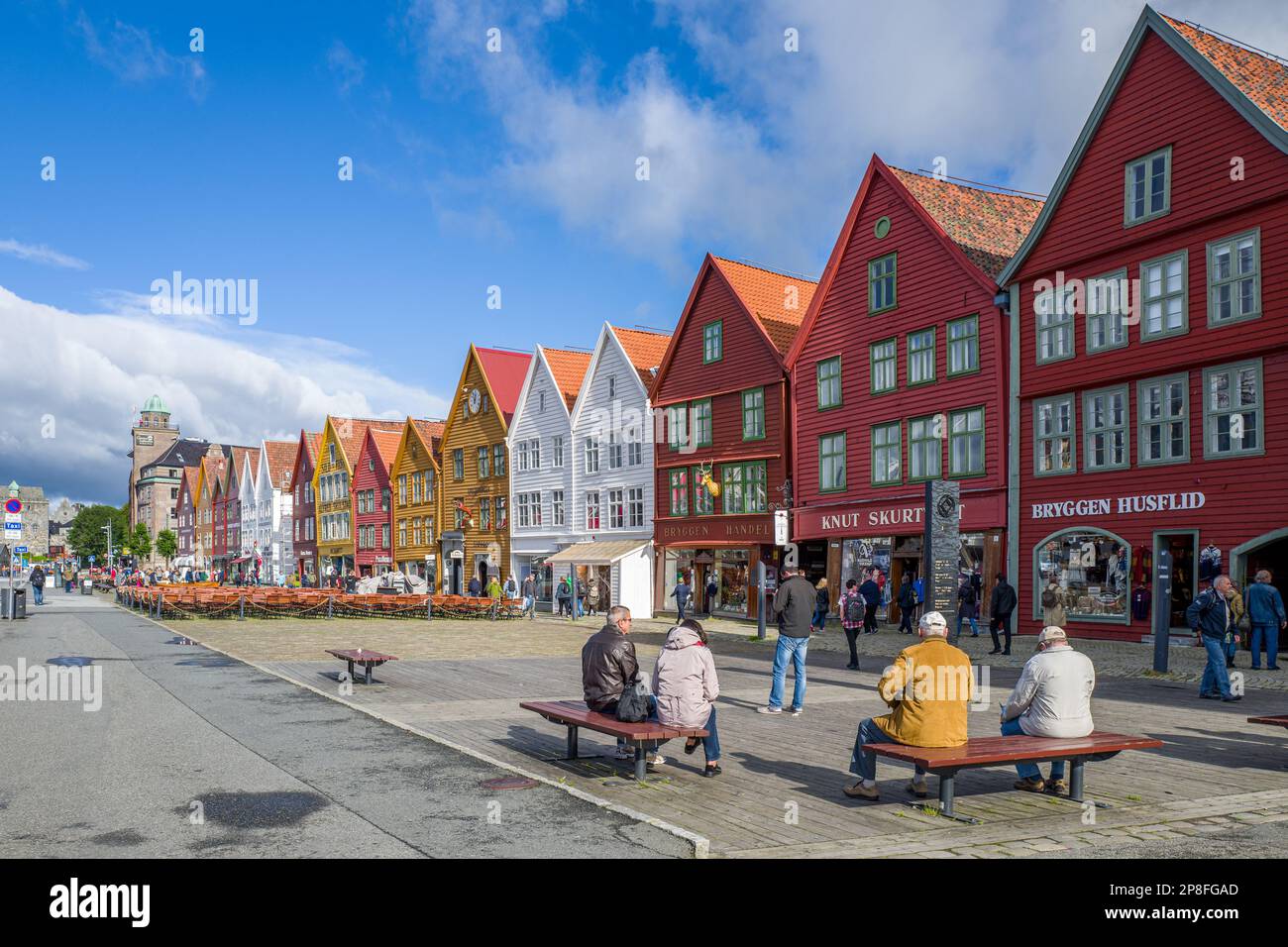 Tourists enjoy Norways most visited tourist attraction Bryggen. Bryggen ...