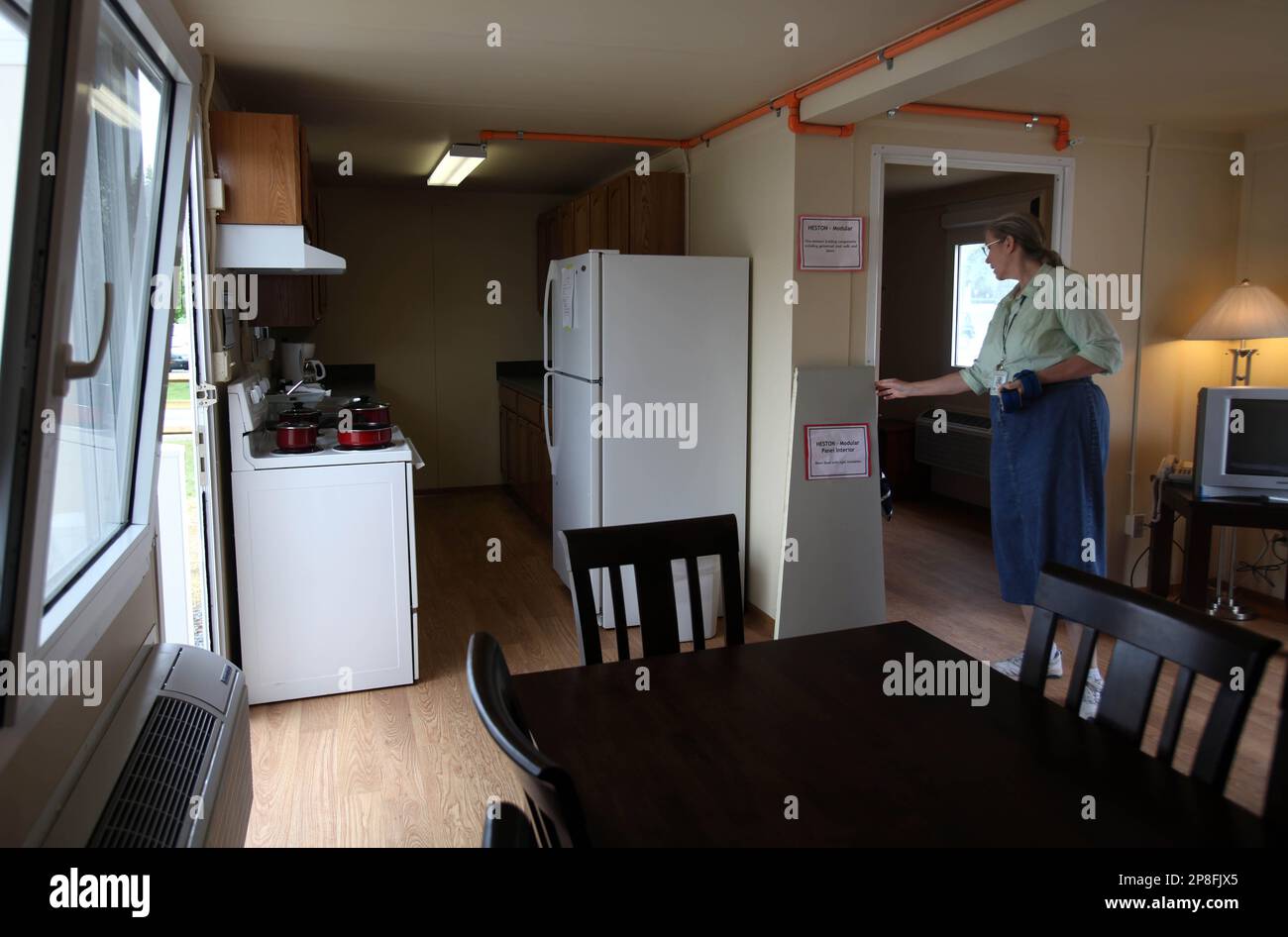 FEMA employee Linda Krut tours the inside of the Heston Modular during ...