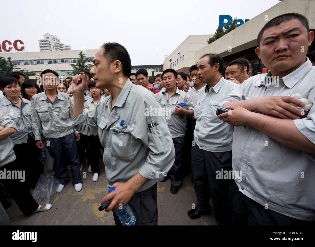 Chinese workers hold protest outside a Panasonic factory in Beijing ...
