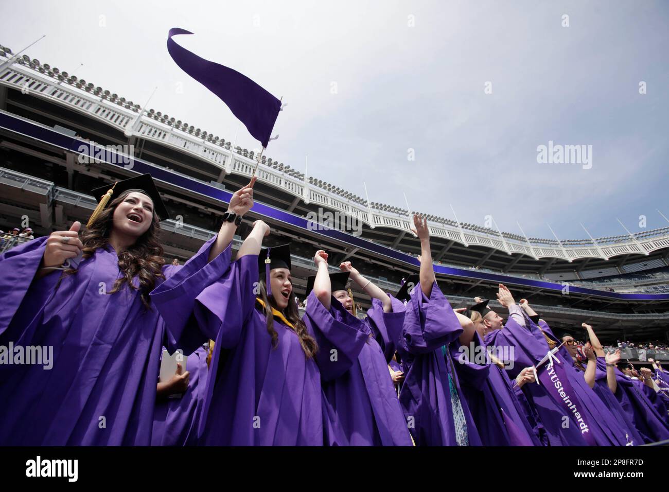 New graduated cheer during the New York University commencement ...