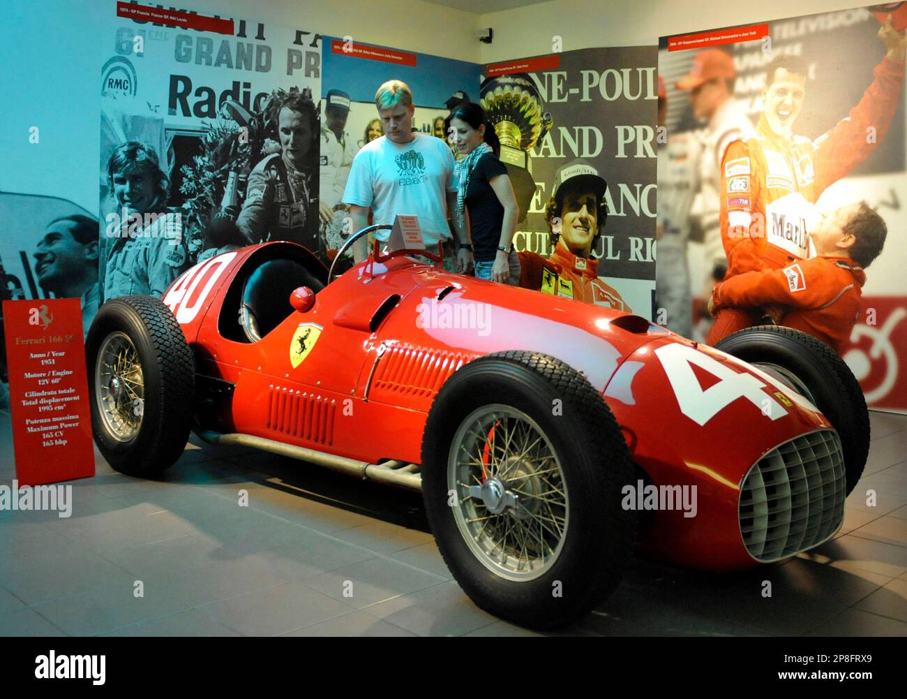 Visitors look at a Ferrari F166, the first Ferrari racing car to take ...