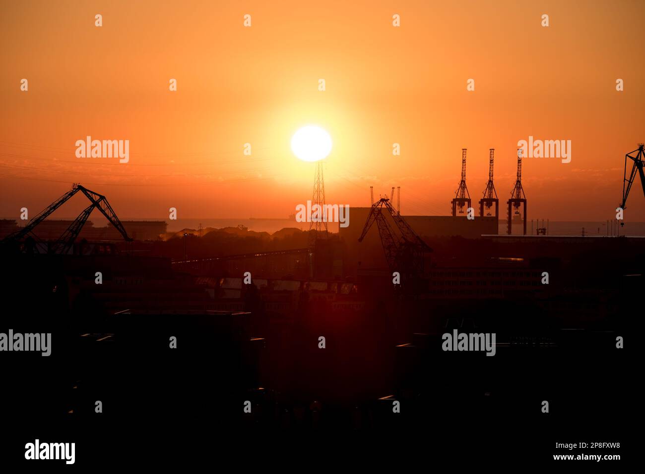 sunset in the port Stock Photo - Alamy