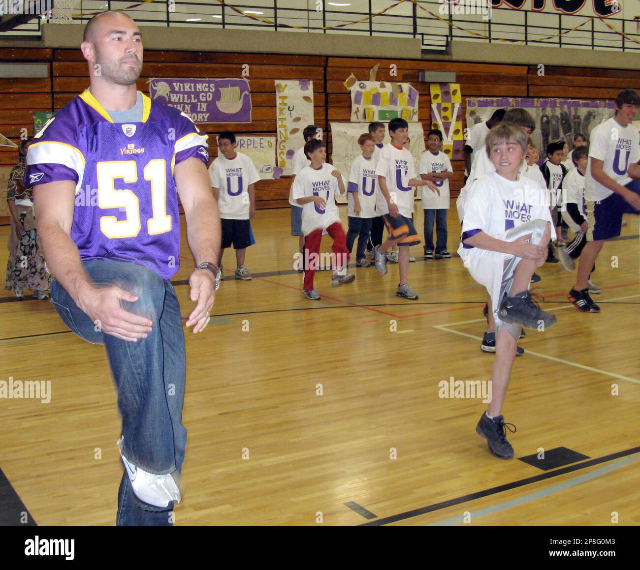 Minnesota Vikings linebacker Ben Leber performs some stretching ...