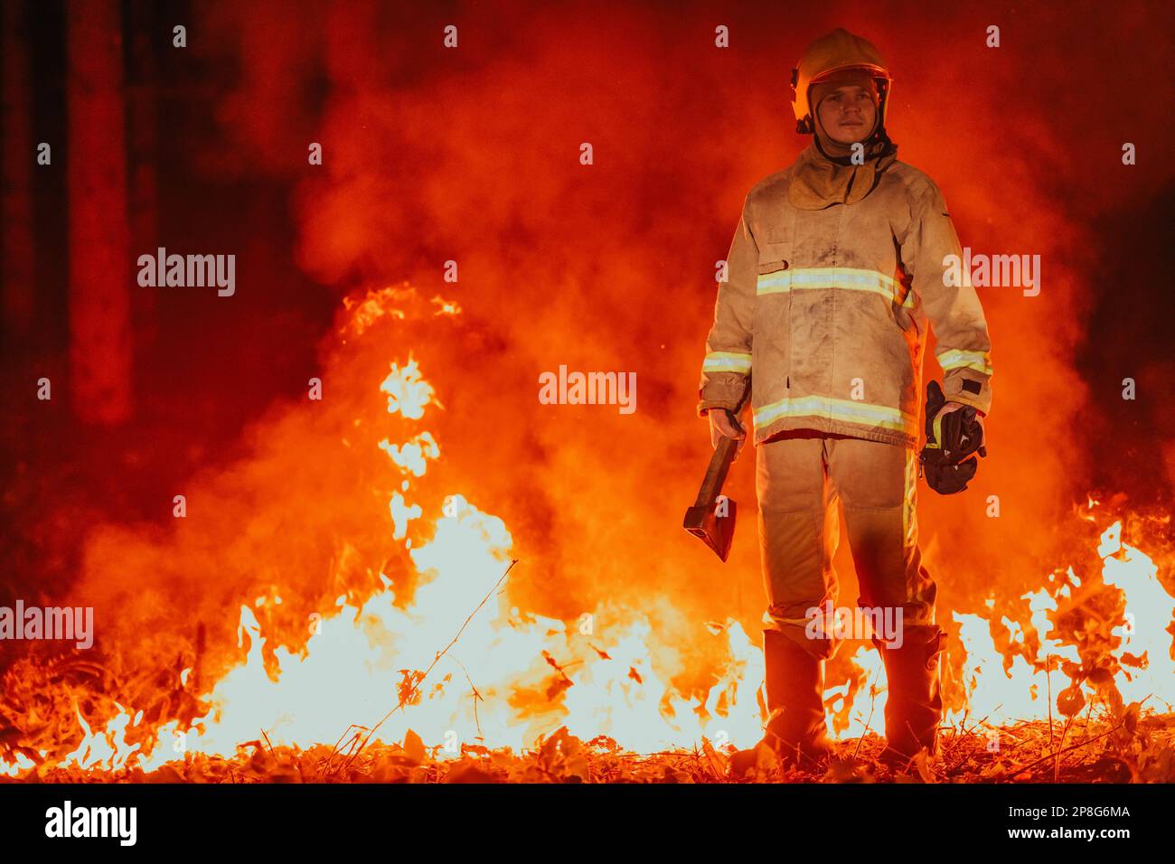 Firefighter at job. Firefighter in dangerous forest areas surrounded by ...