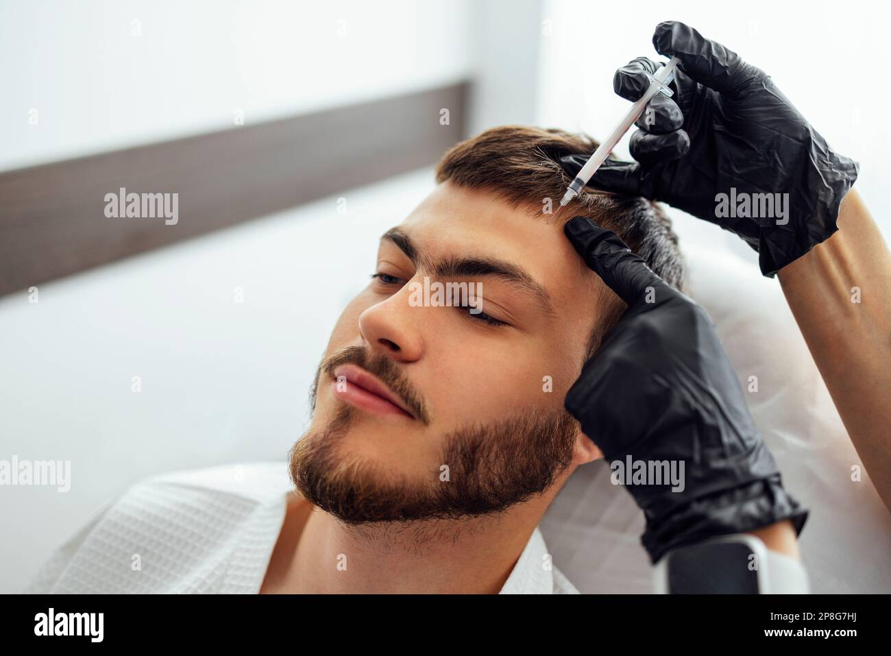 Beauty injections. Female cosmetologist in transparent gloves makes an ...