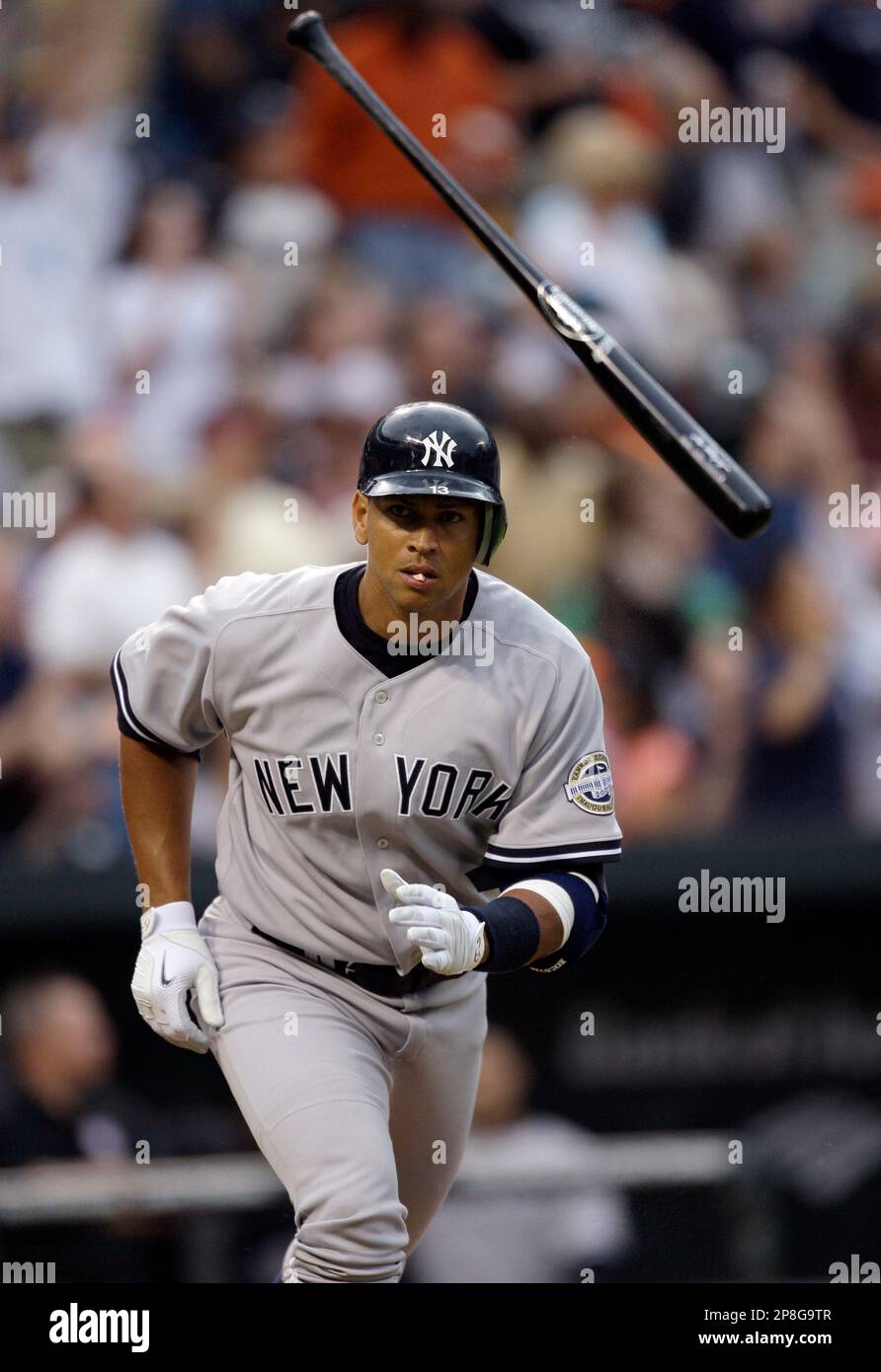 New York Yankees' Alex Rodriguez throws his bat after hitting a three ...