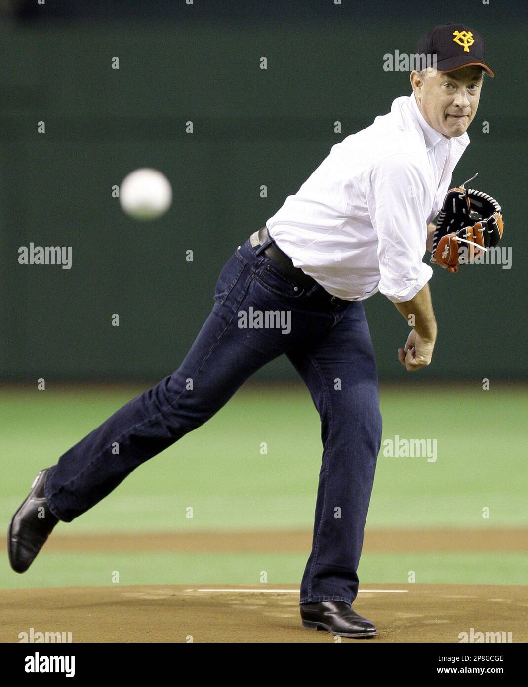 U.S. actor Tom Hanks, wearing a baseball cap of the Yomiuri Giants ...