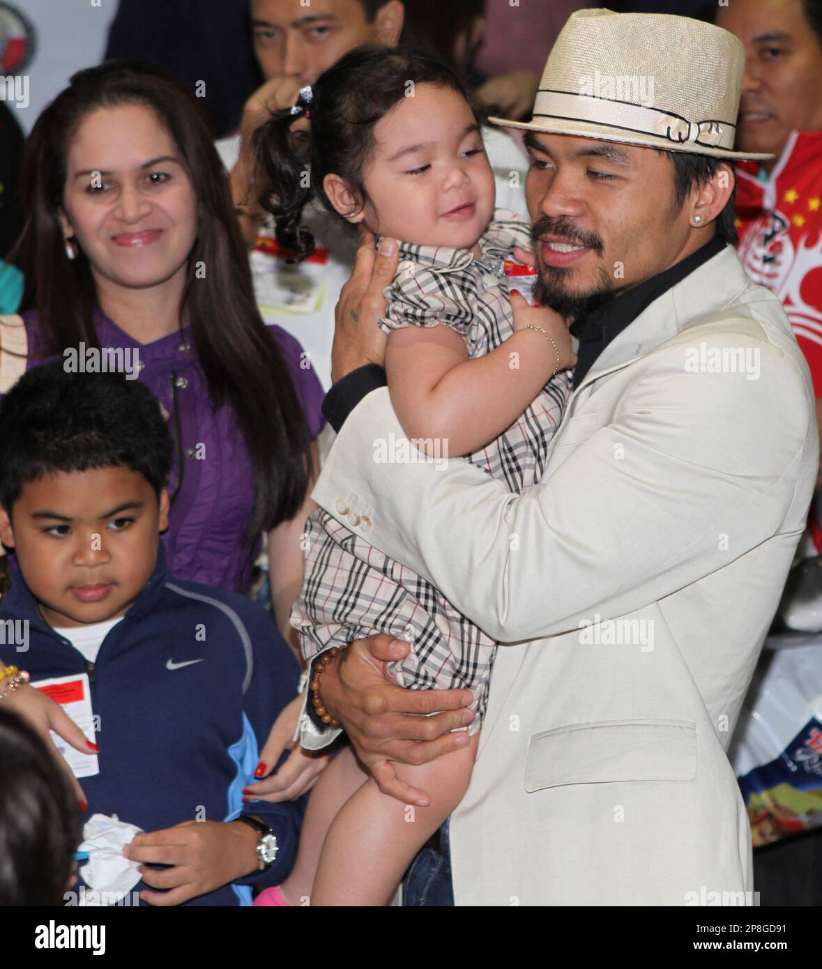 Filipino boxing great Manny Pacquiao, cuddles his daughter Princess ...