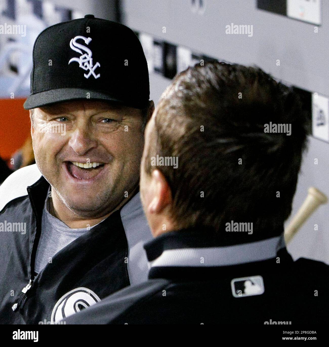 Chicago White Sox pitching coach Don Cooper, left, laughs with his ace ...