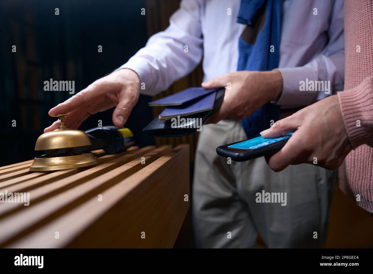 Man in travel clothes calls the hotel staff for registration Stock ...