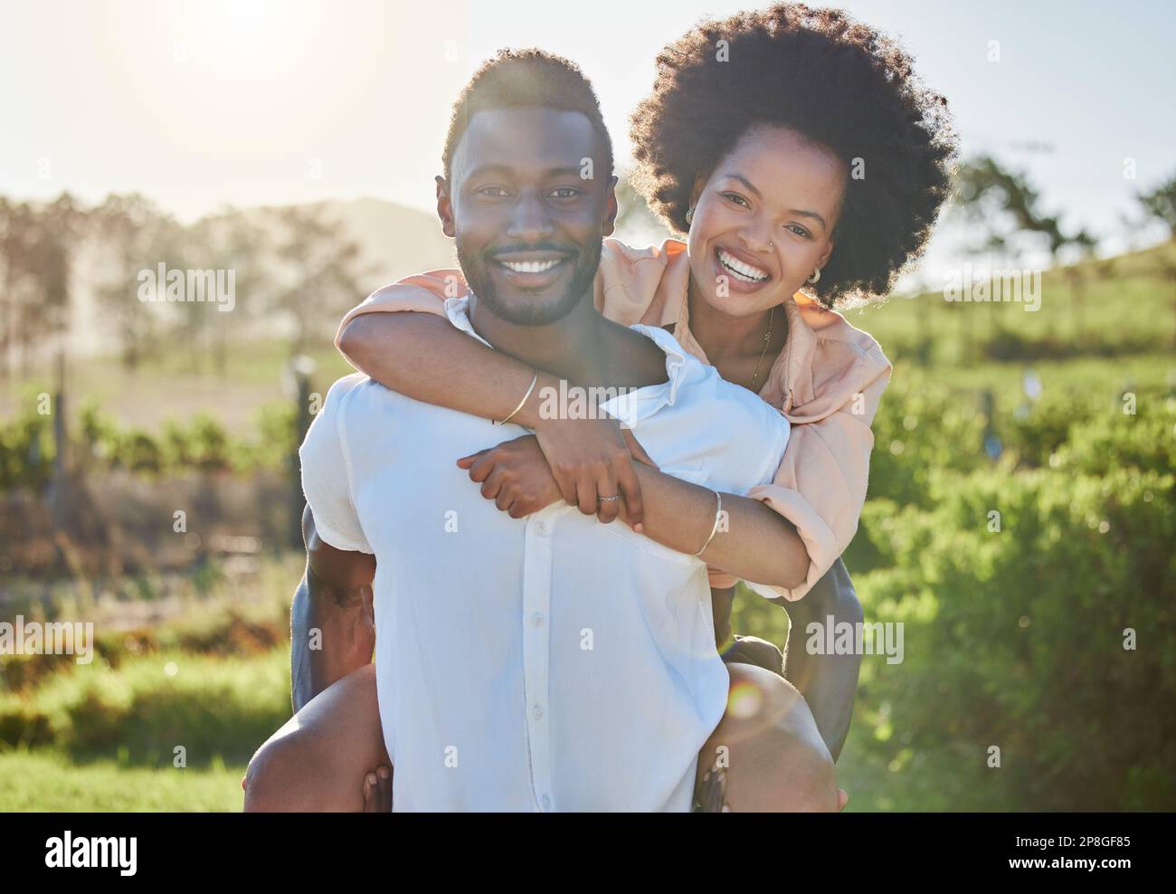 Love, piggyback and couple in nature for a date, marriage hug and smile ...