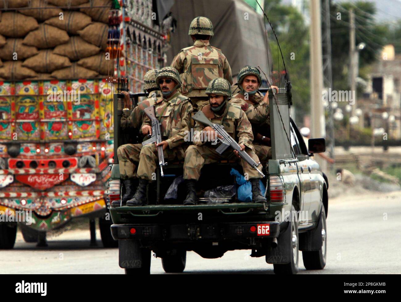 Pakistani soldiers are seen on their way to Pakistan's troubled valley ...