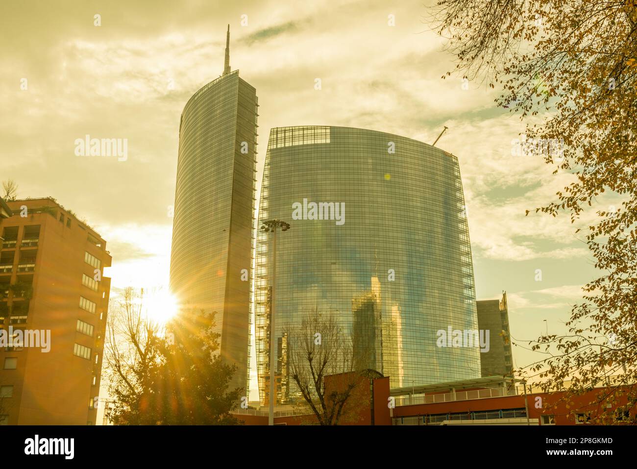 Modern Skyscraper and Trees with Sunbeam in Milan, Lombardy in Italy ...