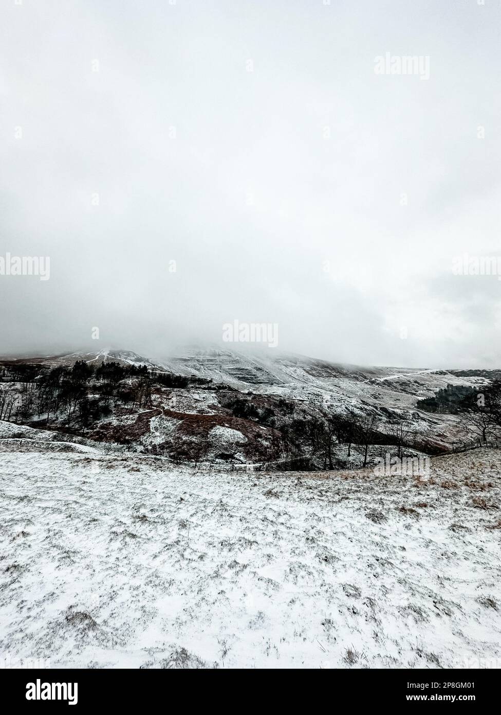 Snowy rocky mountain views at the top of Mam Tor, Peak District on a ...