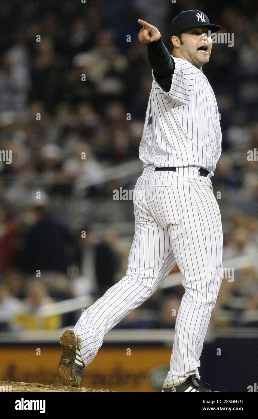 New York Yankees' Joba Chamberlain appeals to the third base umpire for ...