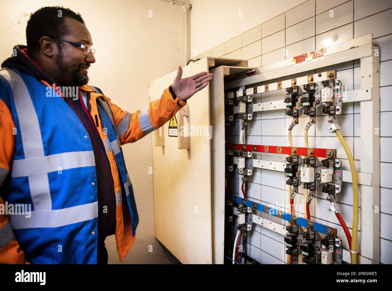 HAARLEM - An employee of Alliander on a project of network operator ...