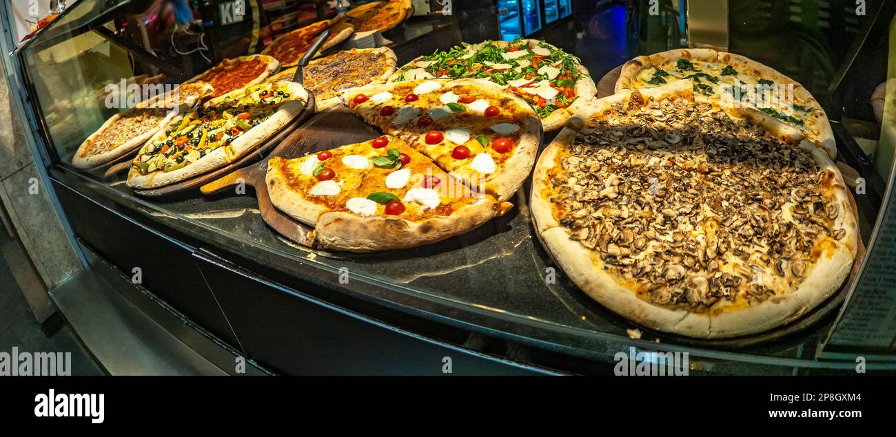 Different kinds of Pizza displayed in a Street Showcase Stock Photo - Alamy