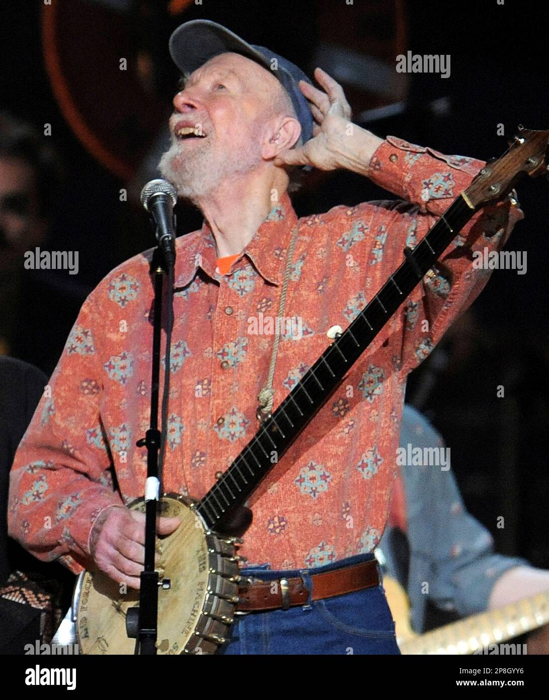 Pete Seeger performs at the benefit concert celebrating his 90th ...