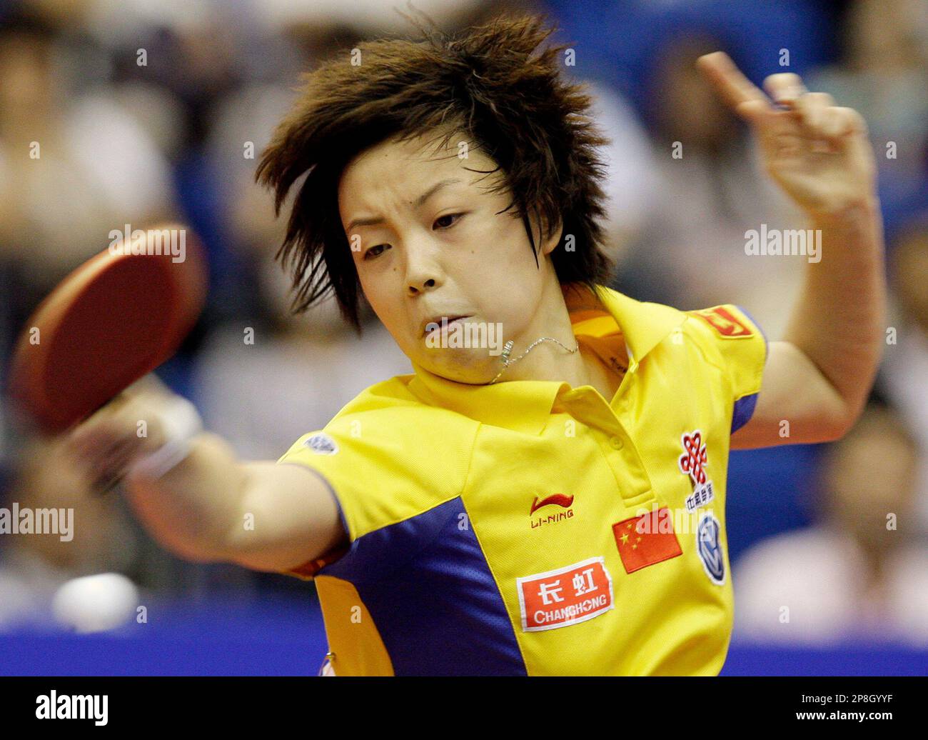 Zhang Yining of China returns the ball against Liu Shiwen of China ...