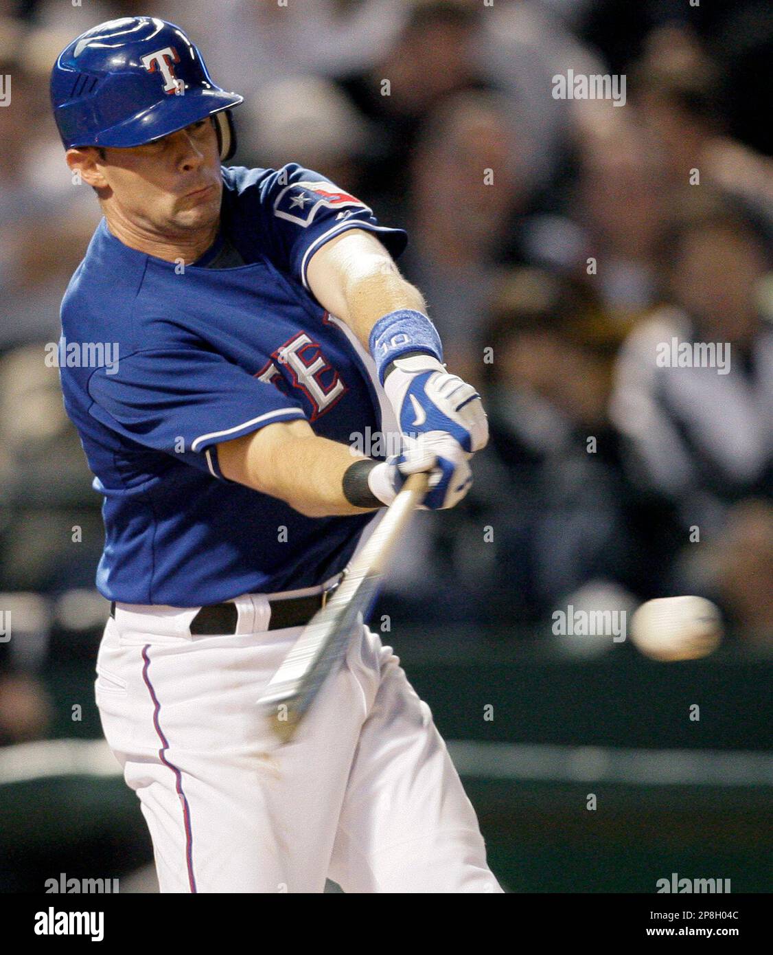 Texas Rangers' Michael Young hits an RBI single off Chicago White Sox ...