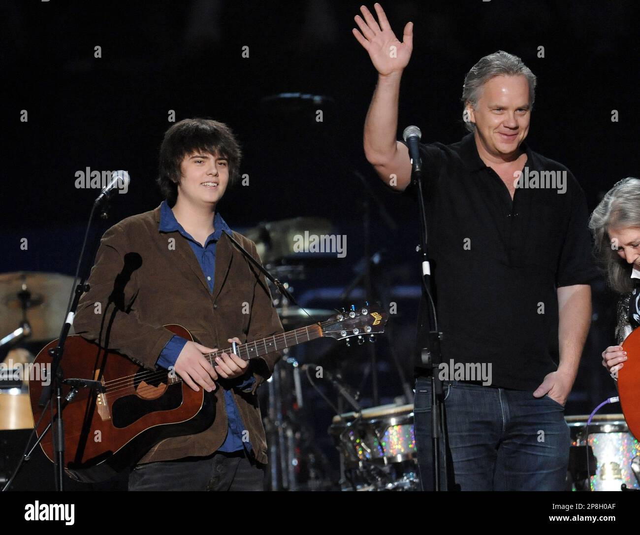 Actor Tim Robbins, right, and son Miles Robbins perform at a benefit ...