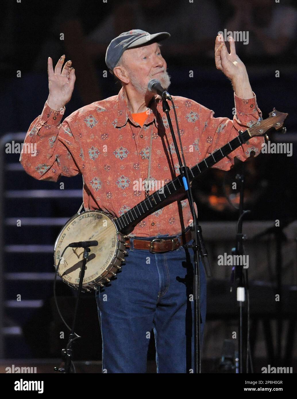 Pete Seeger performs at the benefit concert celebrating his 90th ...