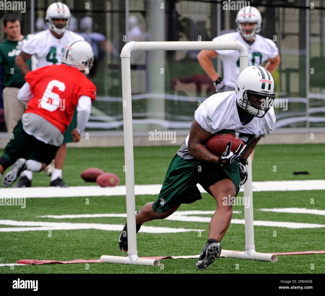 New York Jets running back Shonn Greene runs with the ball through a ...