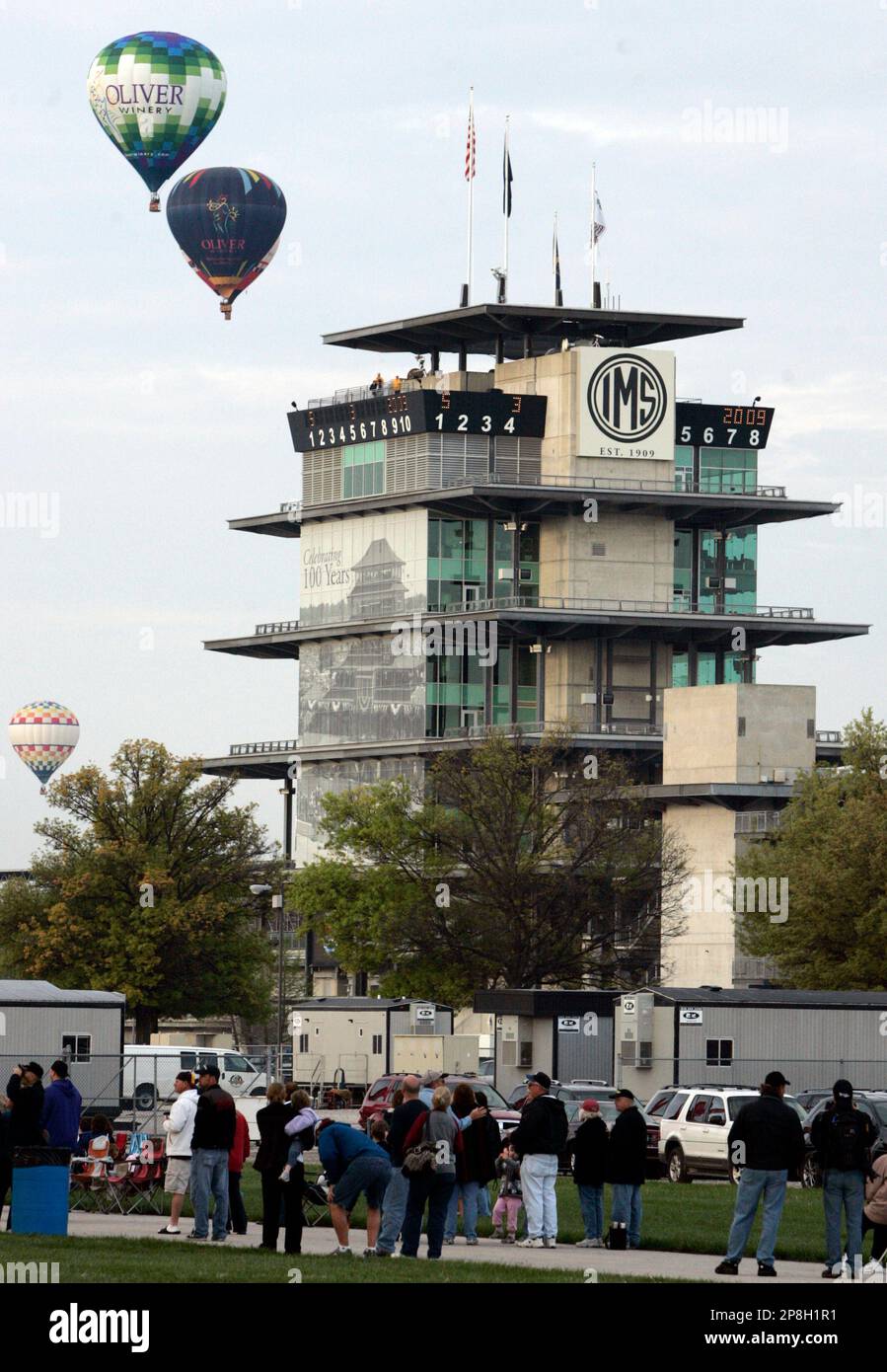 Hot air balloons float over the control tower at the Indianapolis Motor ...