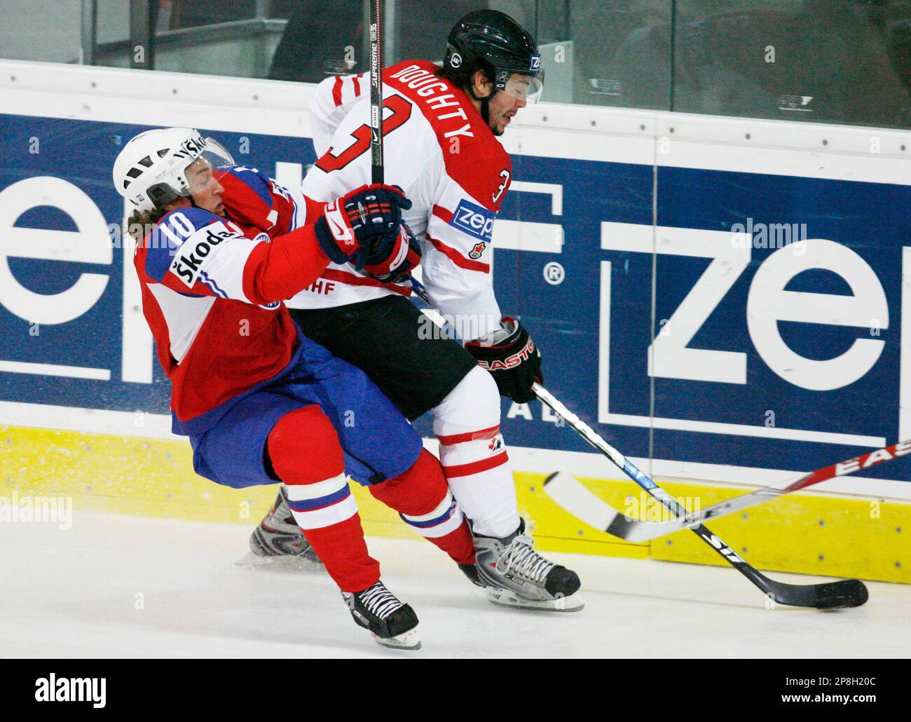 Canada's Drew Doughty, right, and Norway's Lars Erik Spets fight for ...