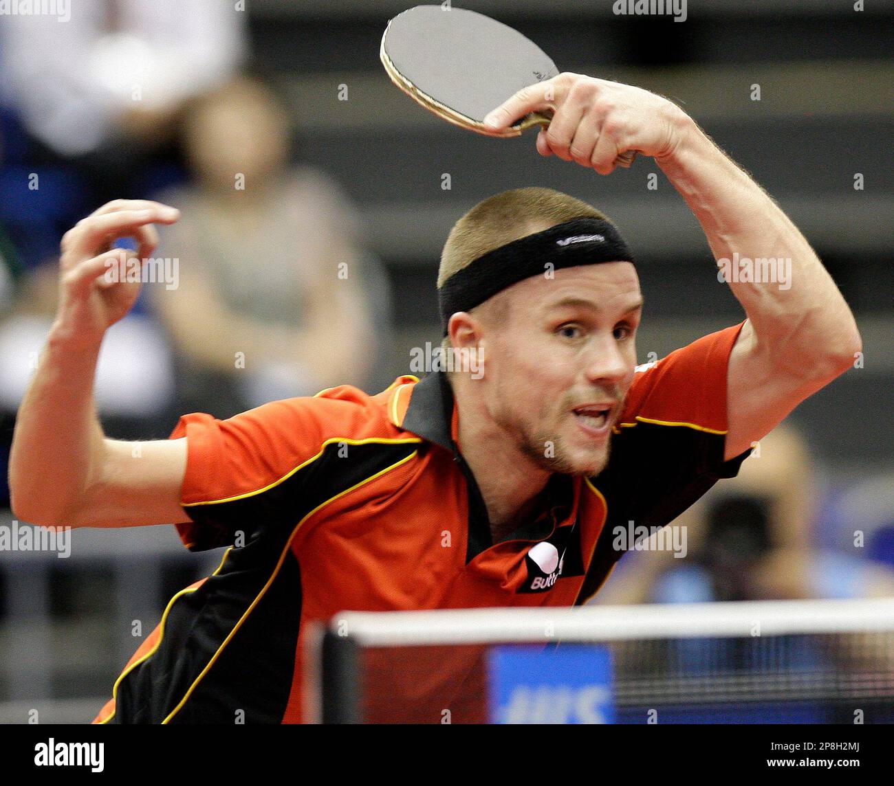 Michael Maze of Denmark returns the ball against Ma Long of China ...