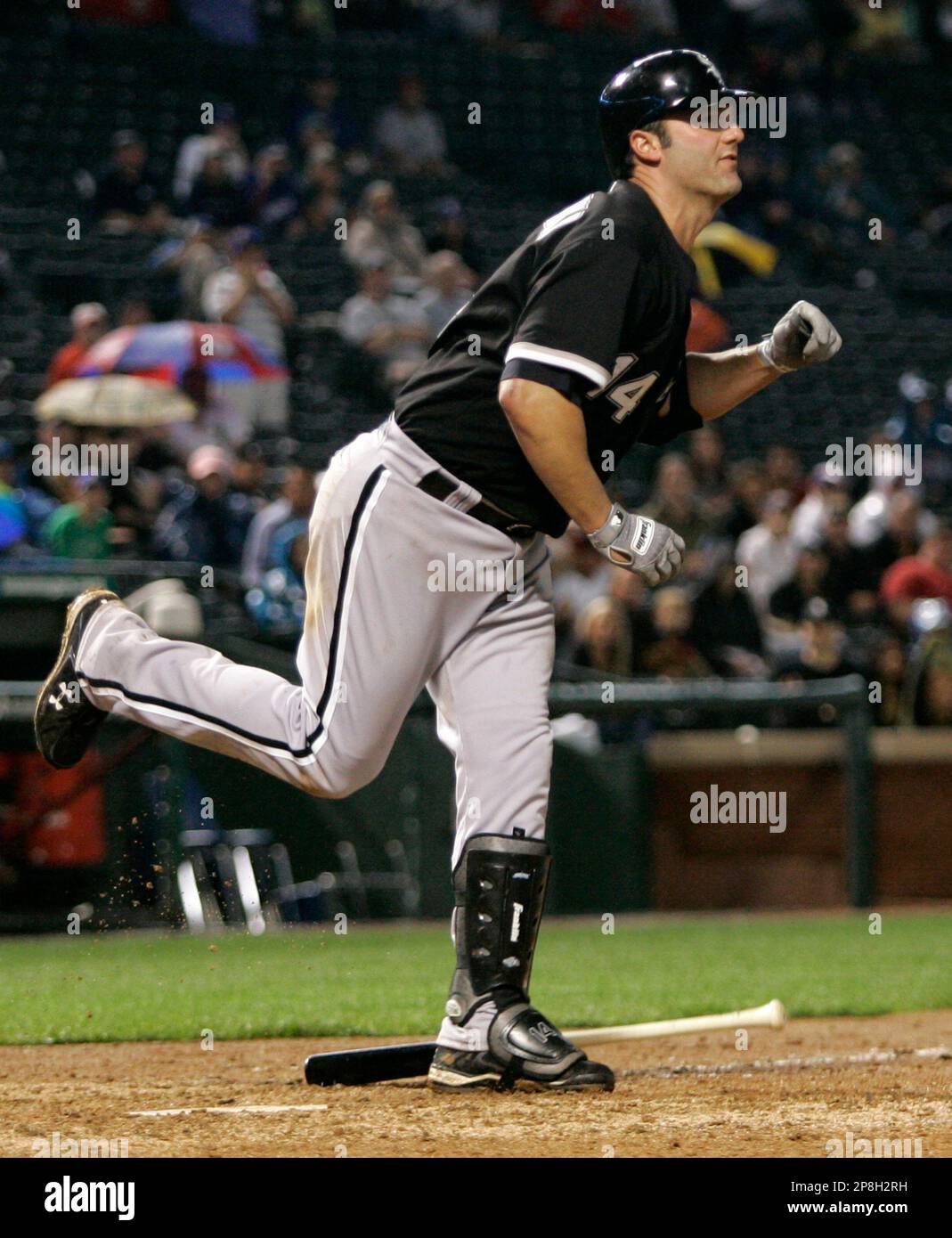 Chicago White Sox first baseman Paul Konerko (14) reacts to being hit ...