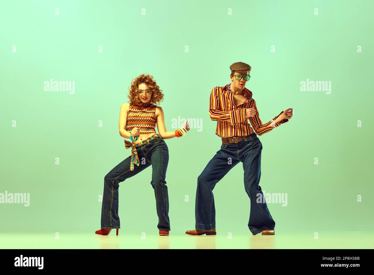 Feeling rhythm. Couple happy people, man and woman in retro style ...