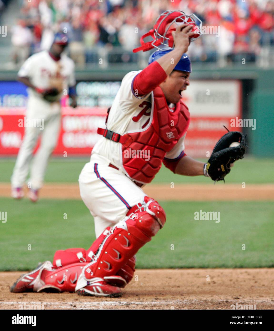 Philadelphia Phillies catcher Carlos Ruiz celebrates after tagging out ...