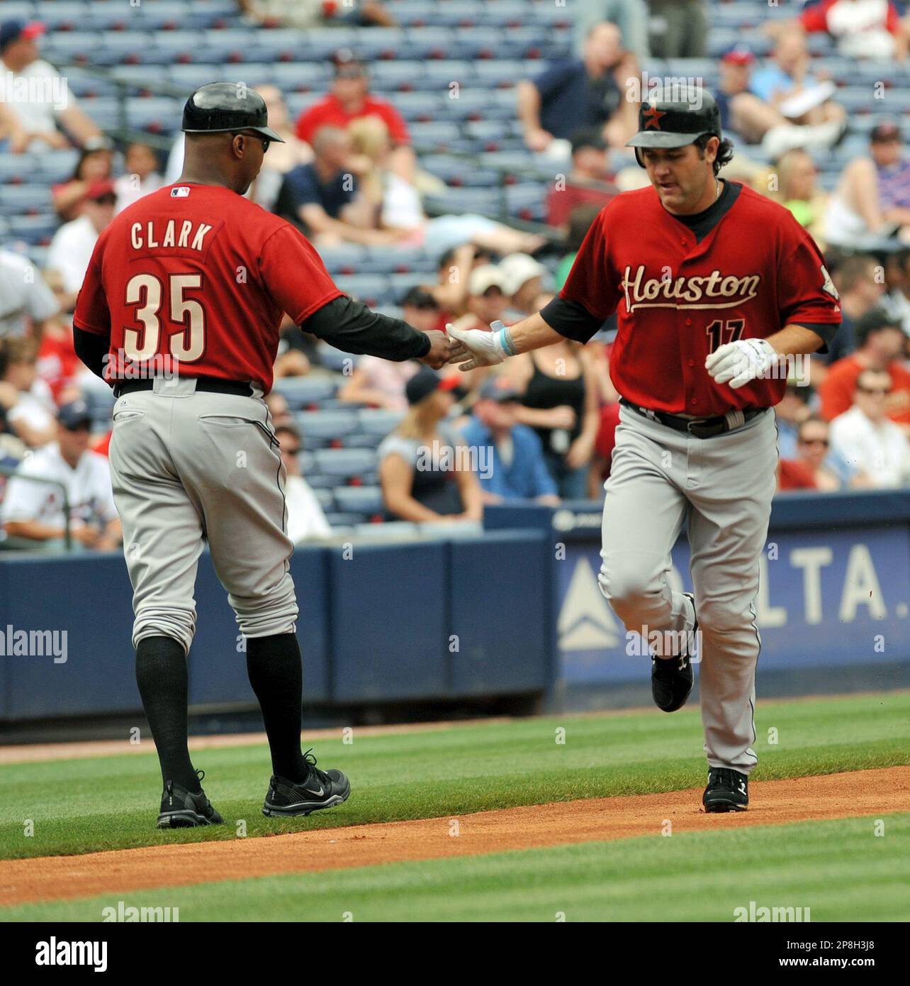 Houston Astros Lance Berkman, right, celebrates with Houston Astros ...