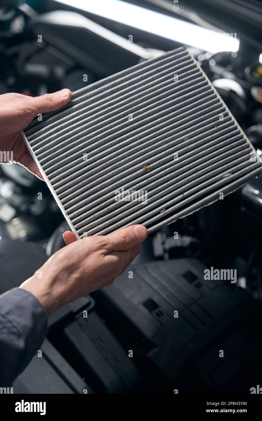 Auto mechanic changing air filter hi-res stock photography and images ...