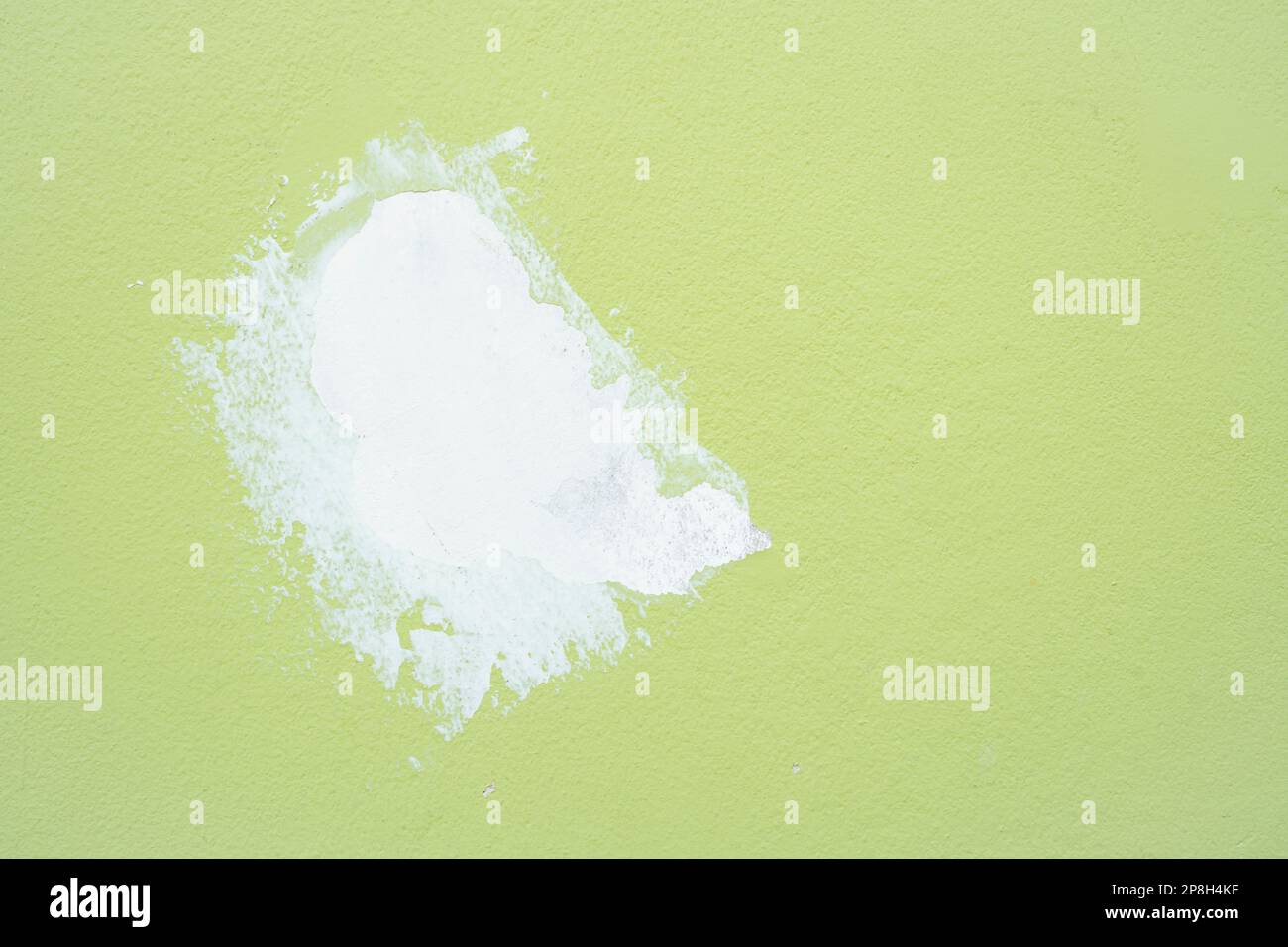 White plastering repair wall paint in to green color wall cement Stock ...