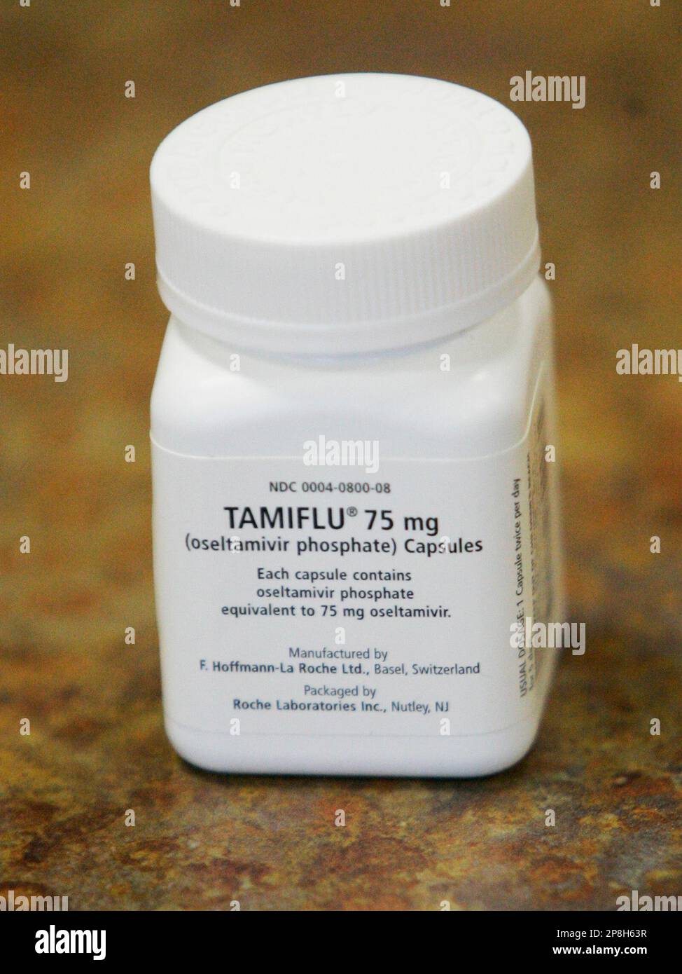 A bottle of Tamiflu sits on a table during a news conference at the ...