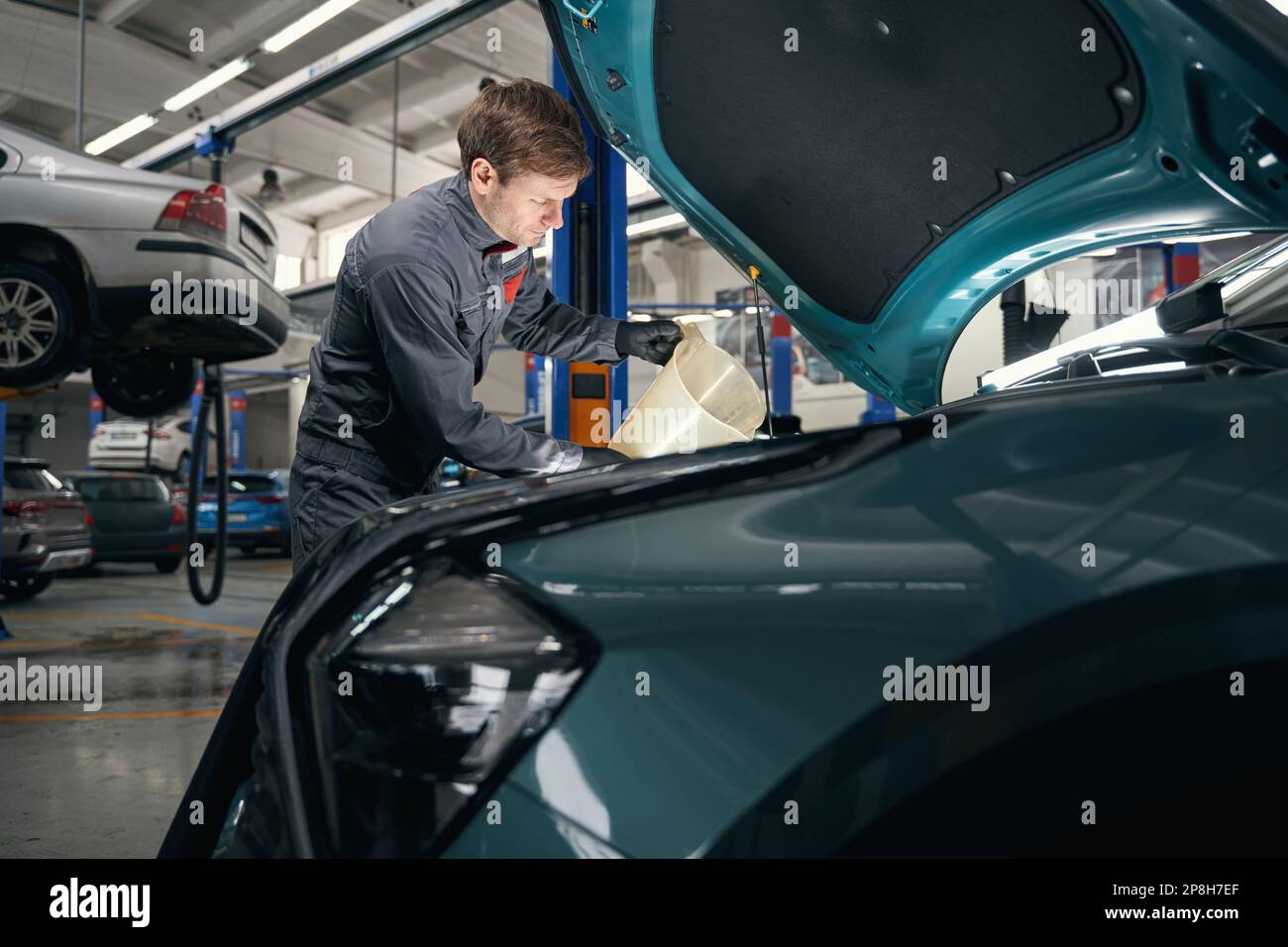 Mechanic conducts full technical inspection of machine Stock Photo - Alamy