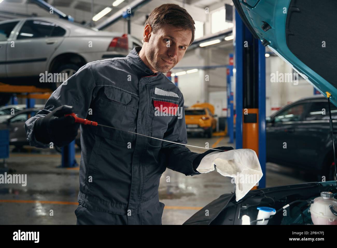 Worker conducts full technical inspection of machine Stock Photo - Alamy