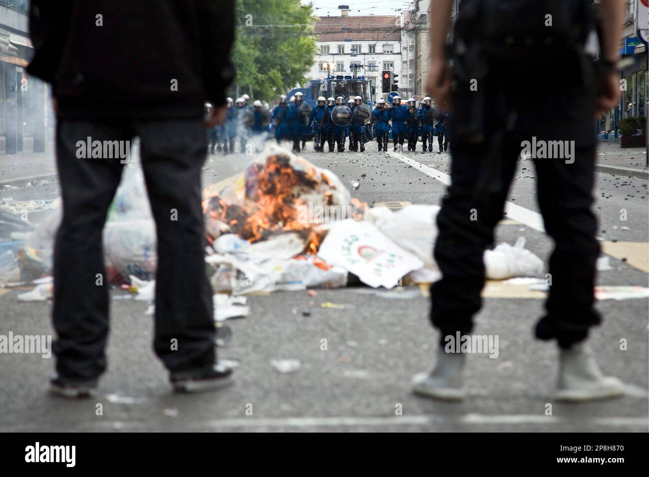 Protesters scuffle with riot police during the labor day demonstration ...