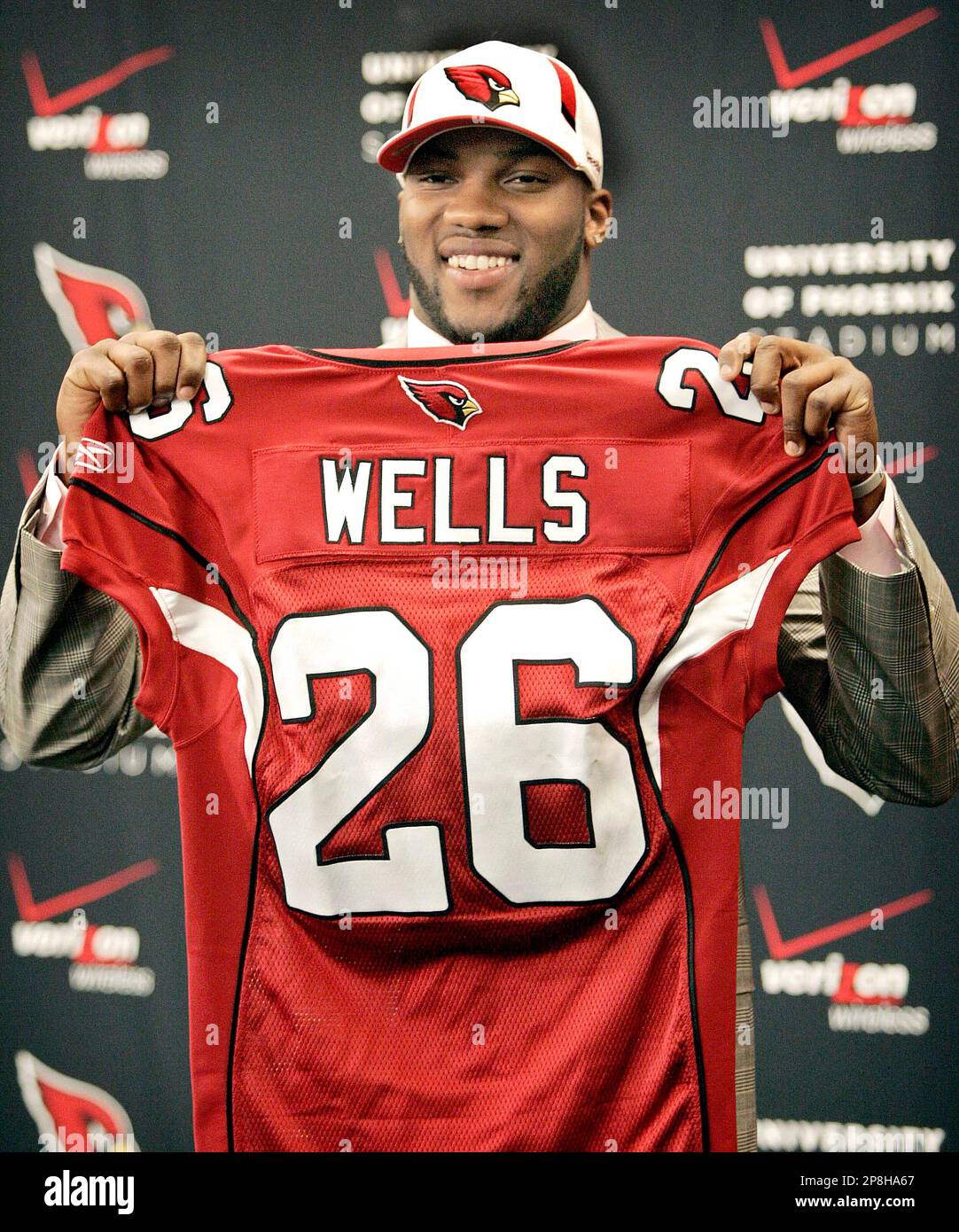 Arizona Cardinals first-round draft pick Chris "Beanie" Wells holds up his jersey during a news ...
