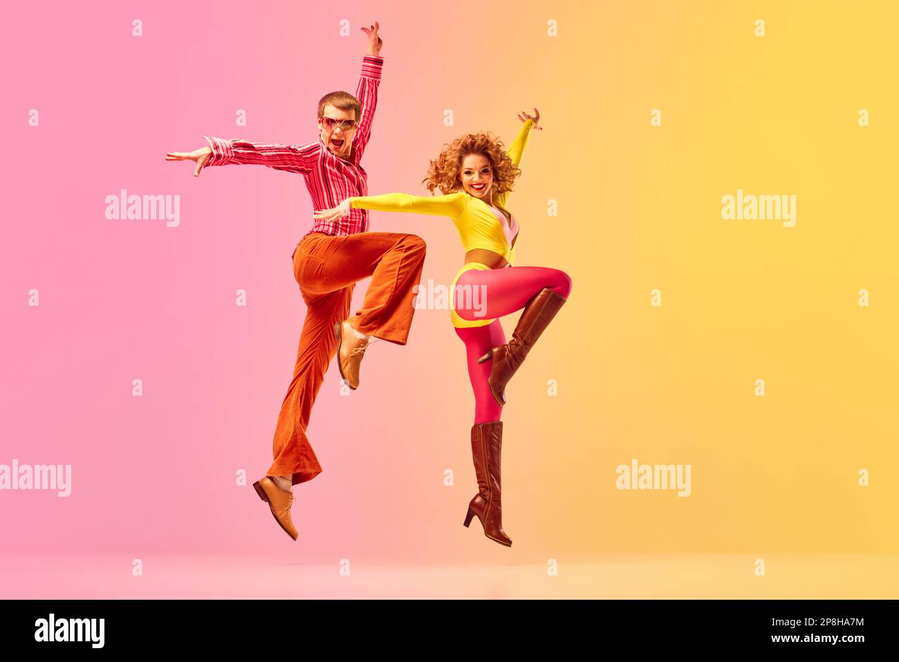 Young stylish emotional man and woman, professional dancers in retro ...