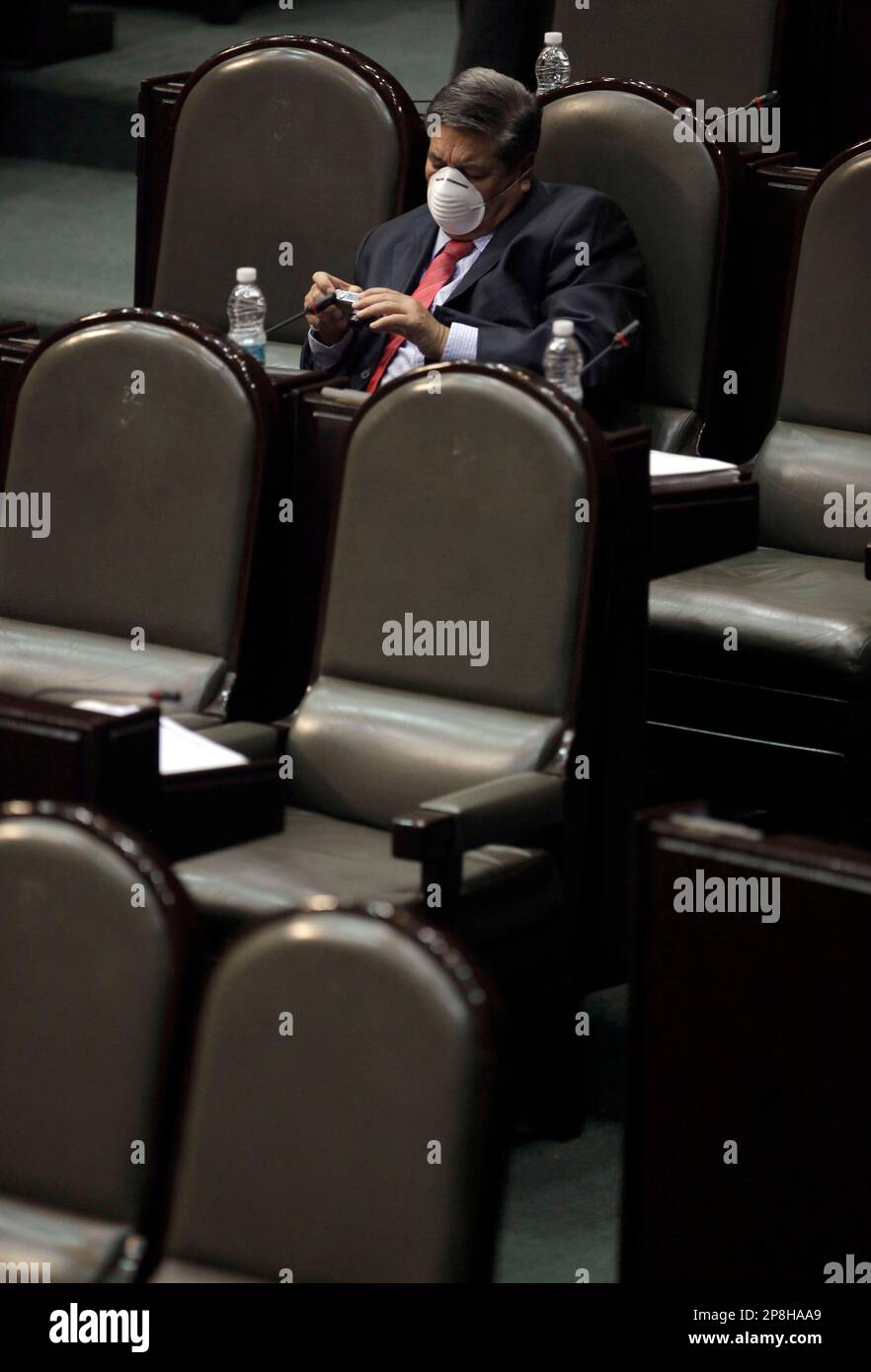 Wearing protective face mask to prevent infection from swine flu, a ...