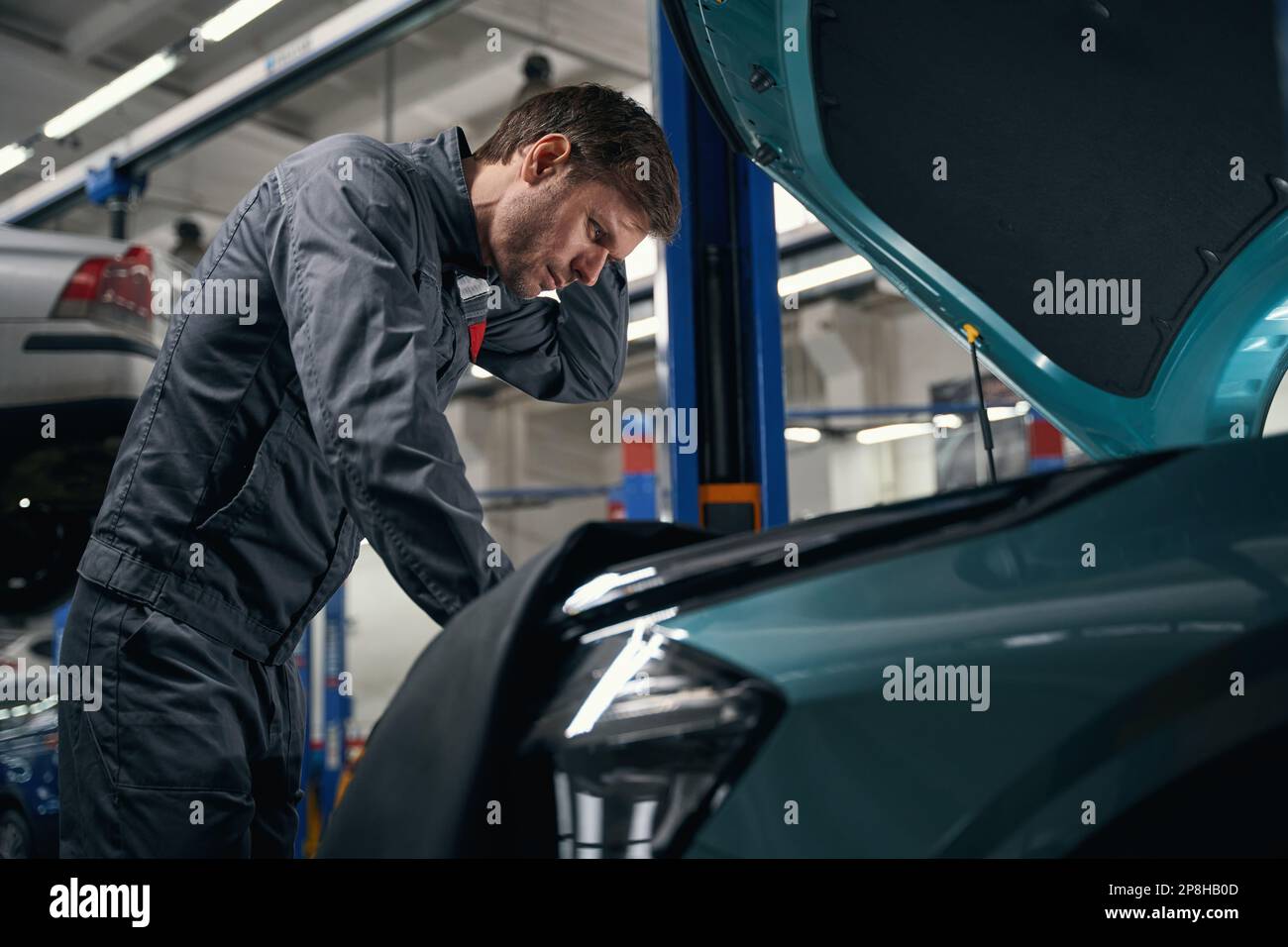 Man conducts full technical check of machine Stock Photo - Alamy