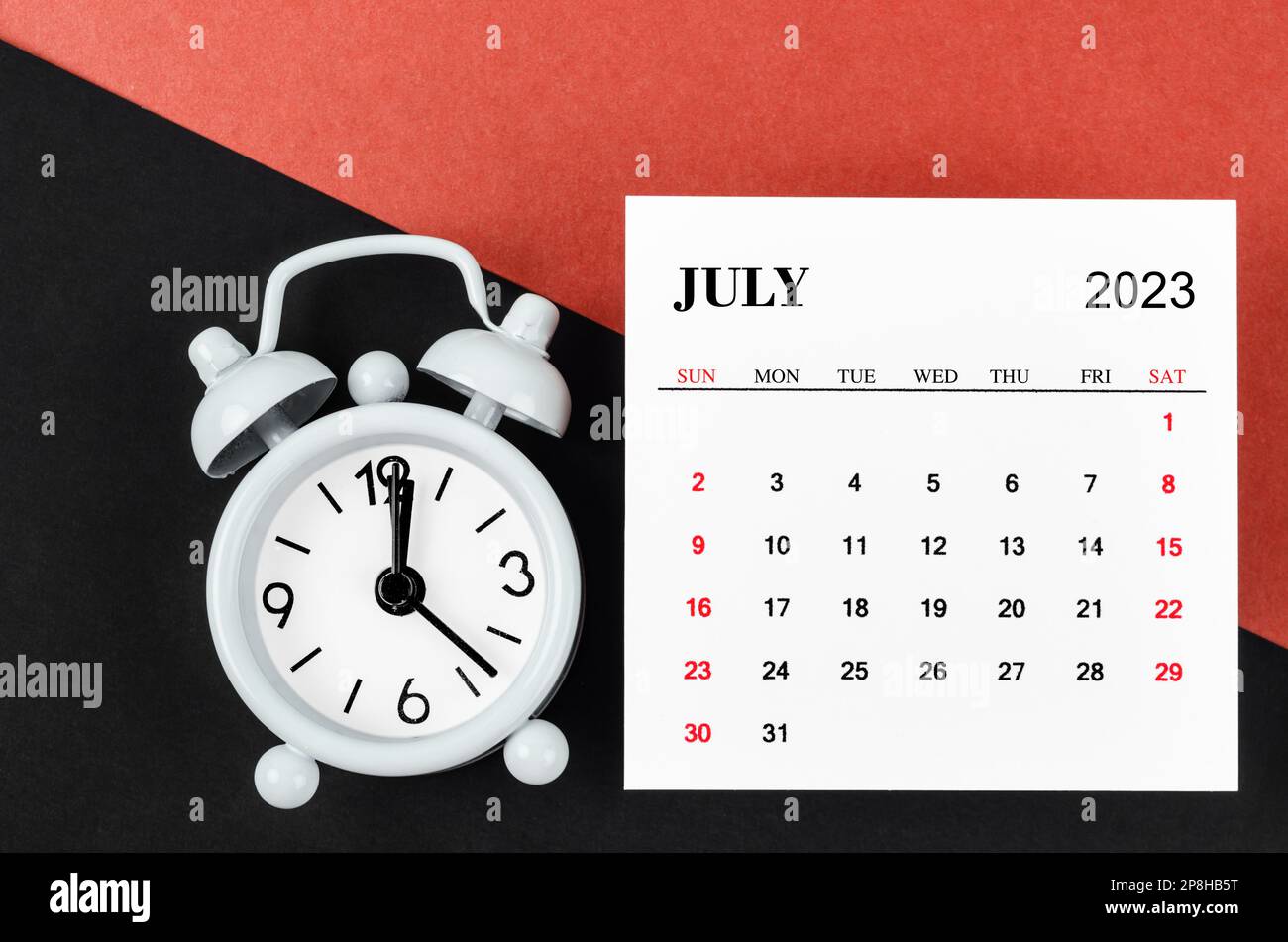 July 2023 Monthly calendar year with alarm clock on red and black ...