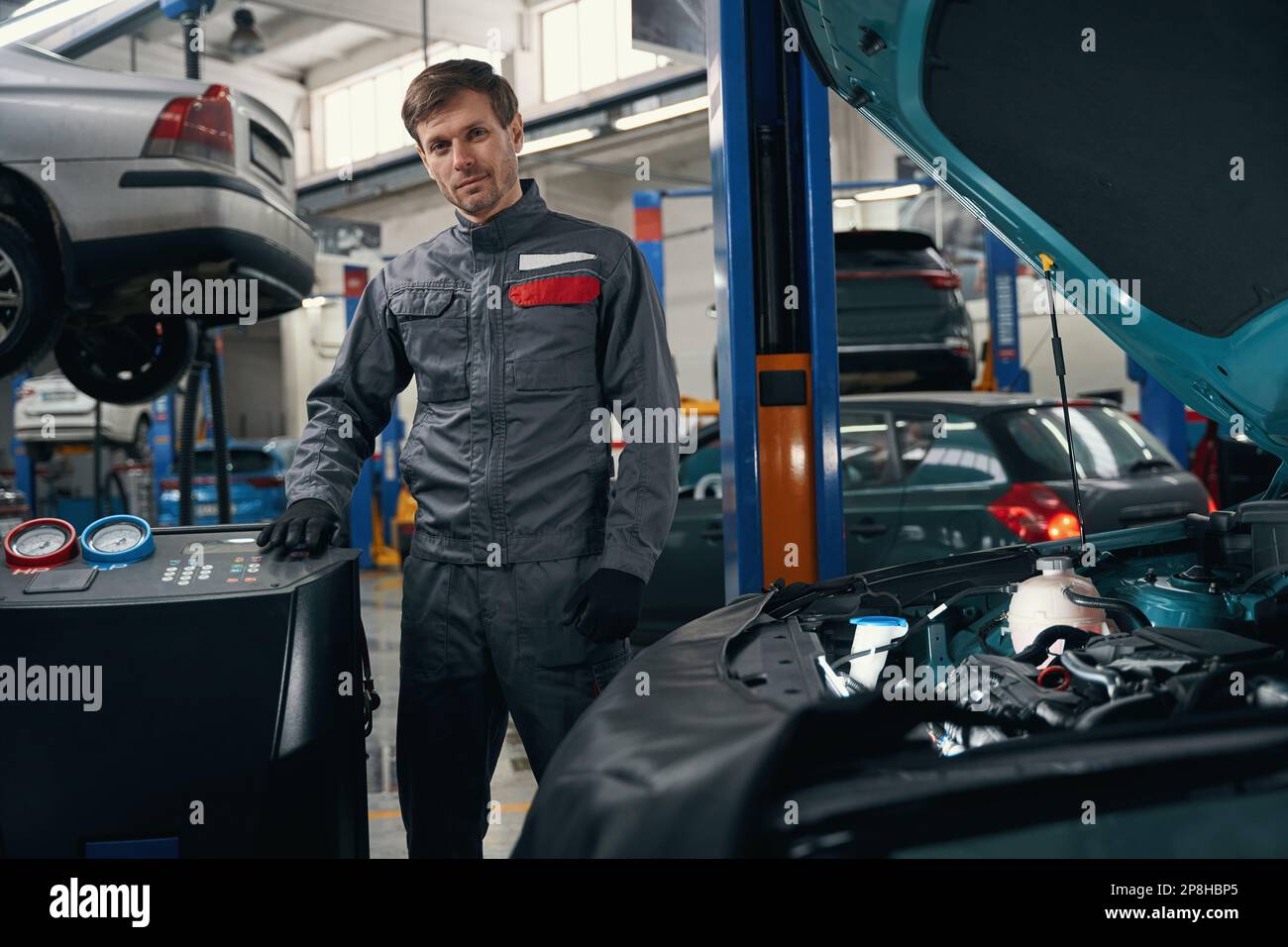 Customer standing with mechanic by car hi-res stock photography and ...