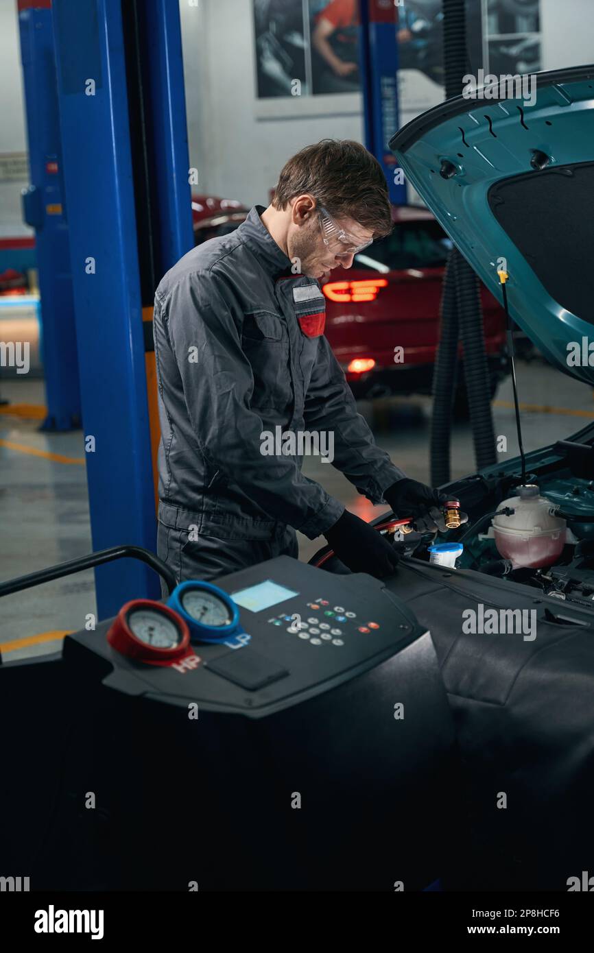 Man conduct full technical inspection of air conditioner Stock Photo ...