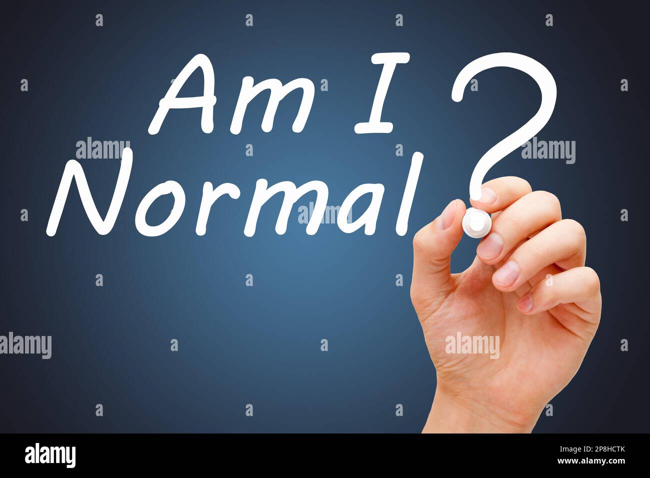 Hand writing the question Am I Normal with white marker on transparent ...