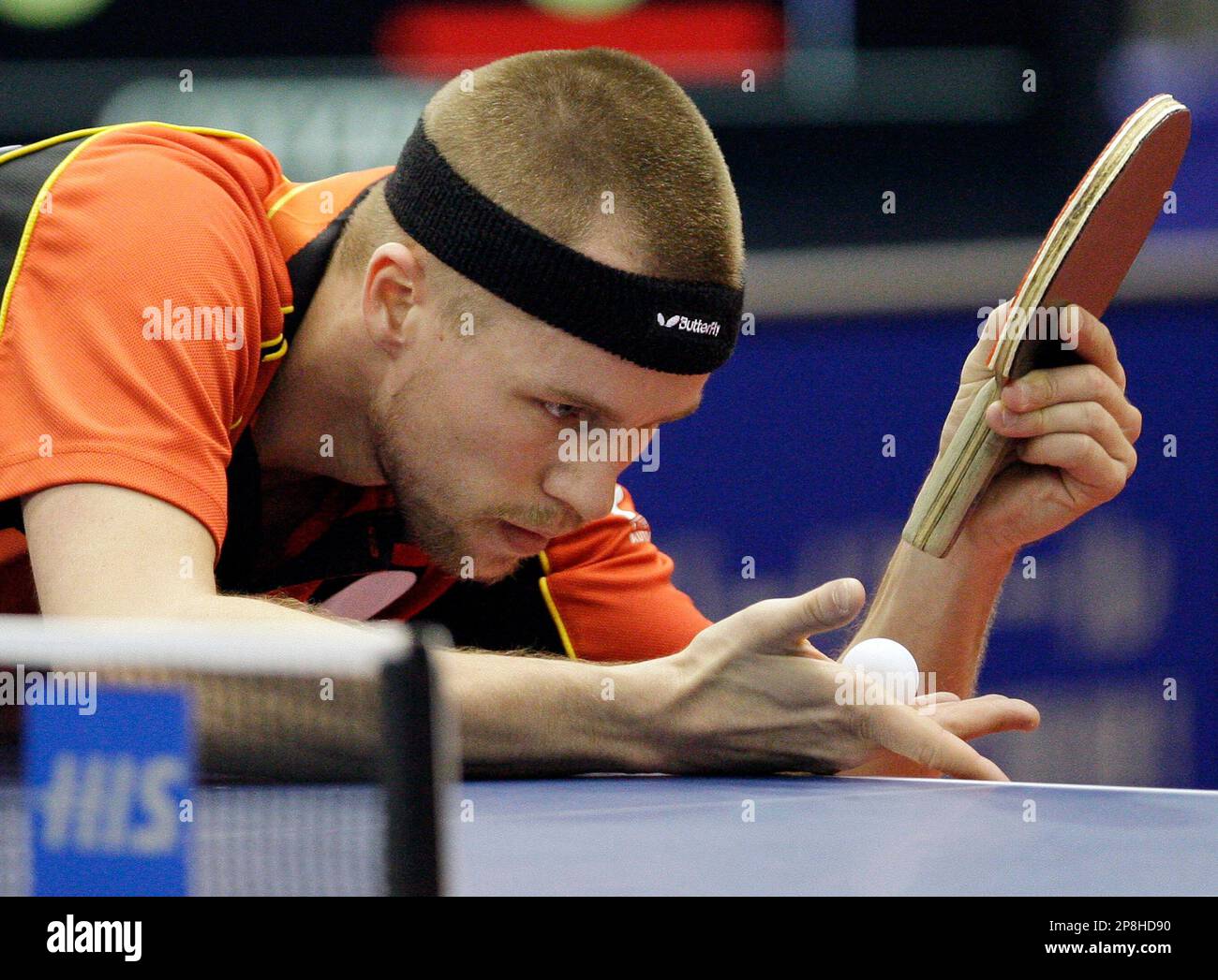 Michael Maze from Denmark serves the ball against Lee Jin kwon of South ...