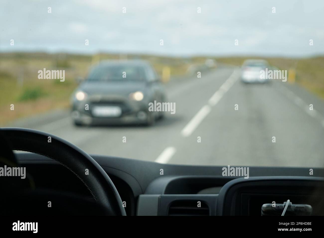 Driving a car - perspective of a driver - bokeh effect Stock Photo - Alamy